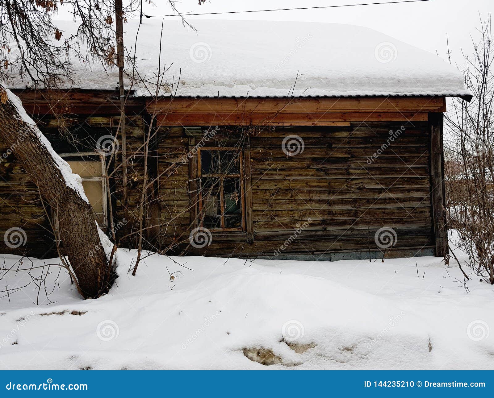 Old Abandoned House with a Broken Window on the Background of Snow in ...