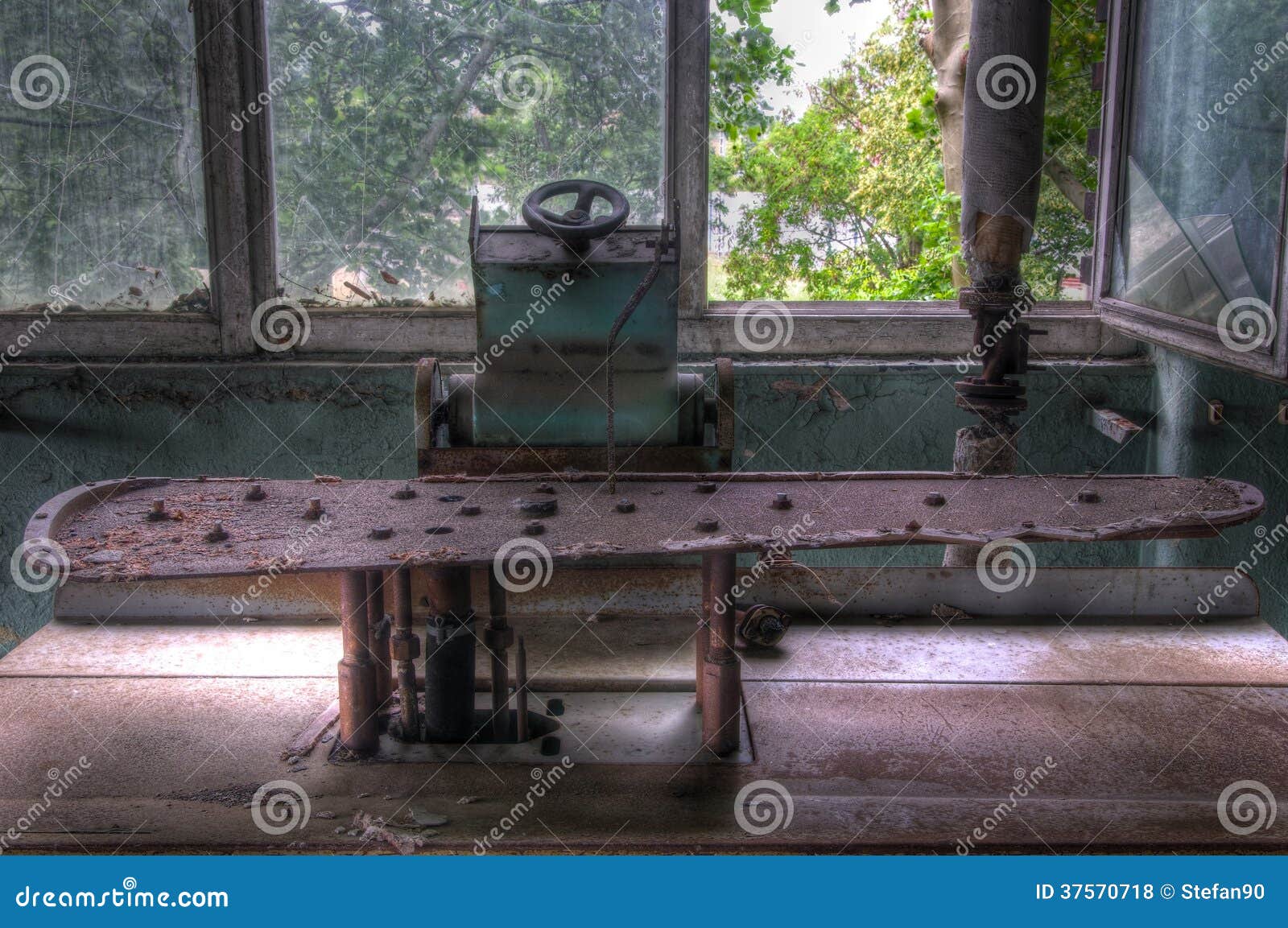 Old Abandoned Laundry Ironing Machine in Stock Photo - Image of ...