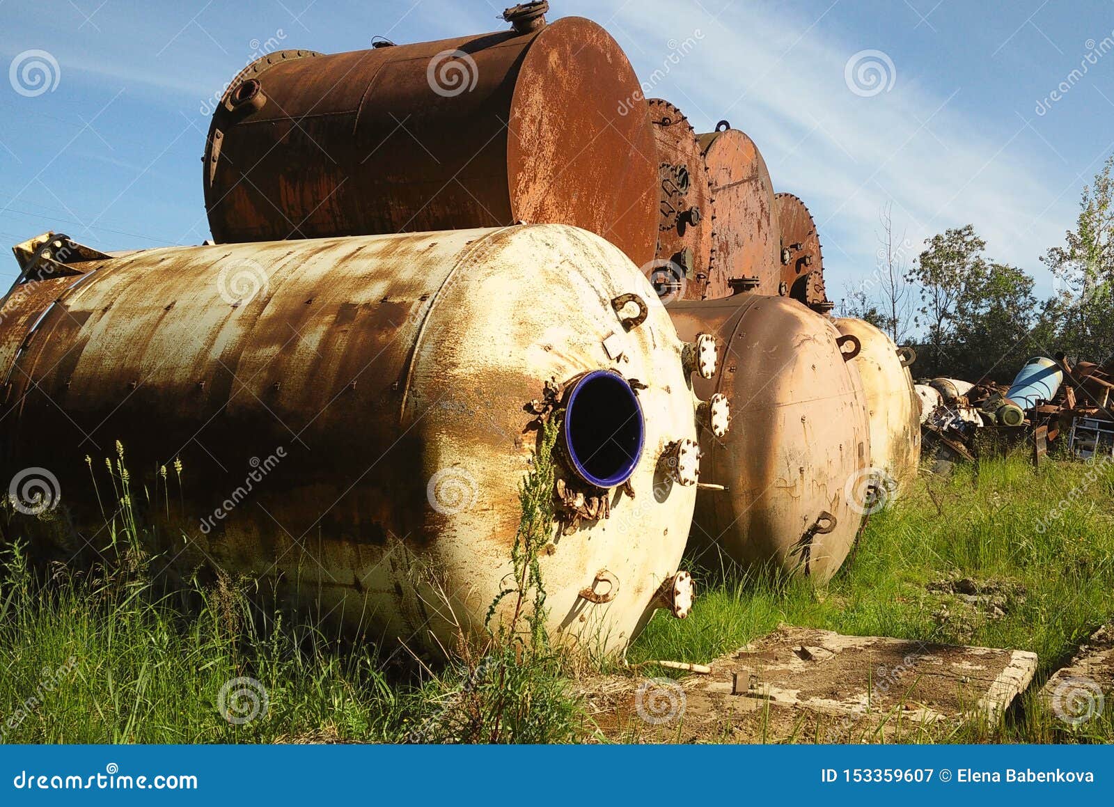 Old abandoned rusty tanks stock image. Image of blue - 153359607