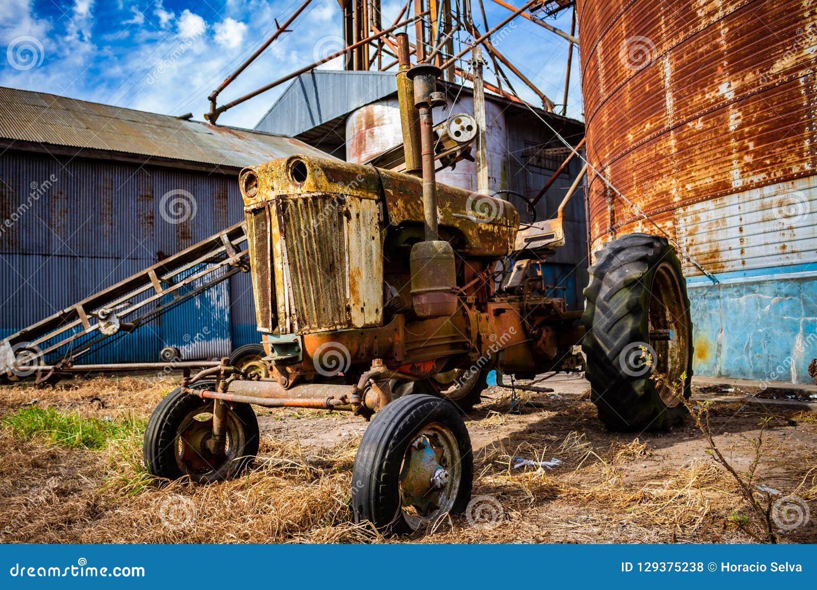 Old abandoned tractor stock photo. Image of antique - 129375238