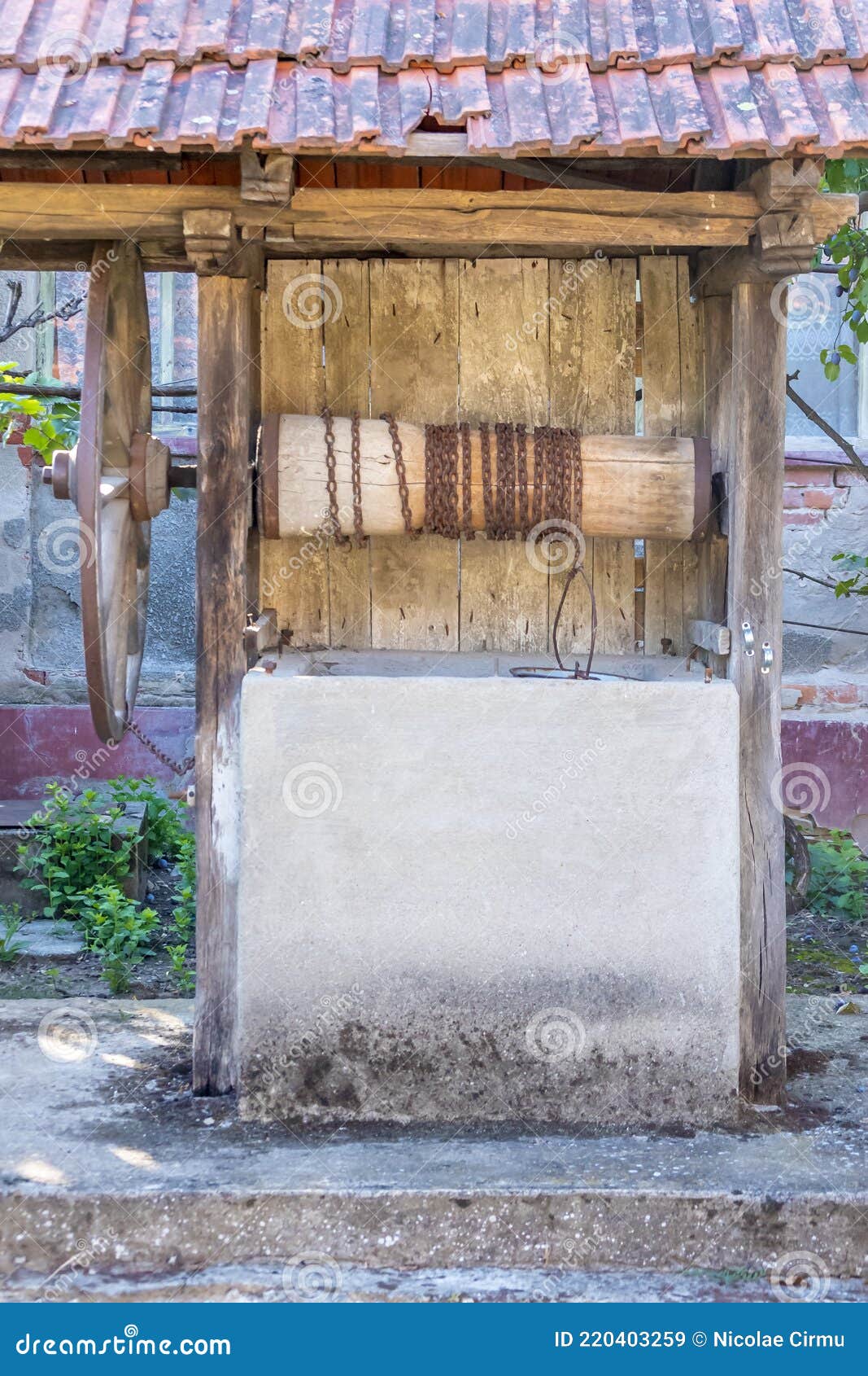 Old Abandoned Water Well with Rusty Wheel in the Village. Stock Image ...