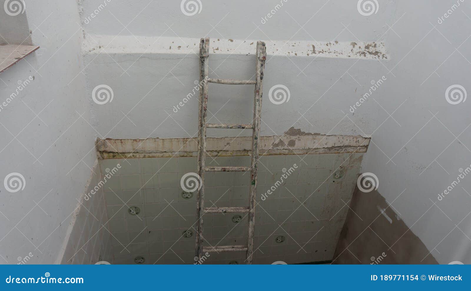 Old Aged and Rusty Metallic Ladder on the White Wall Stock Photo ...