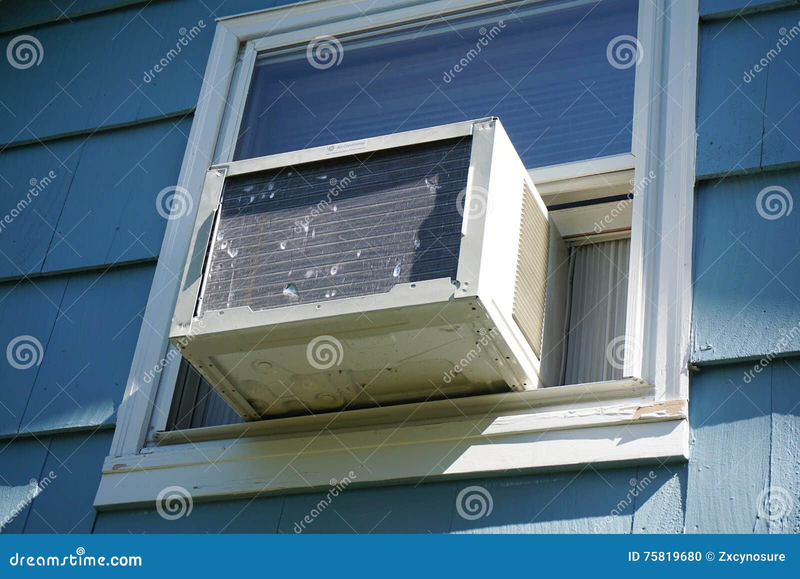 An Air Conditioner Is Installed On The Wall Of The Residential Building ...