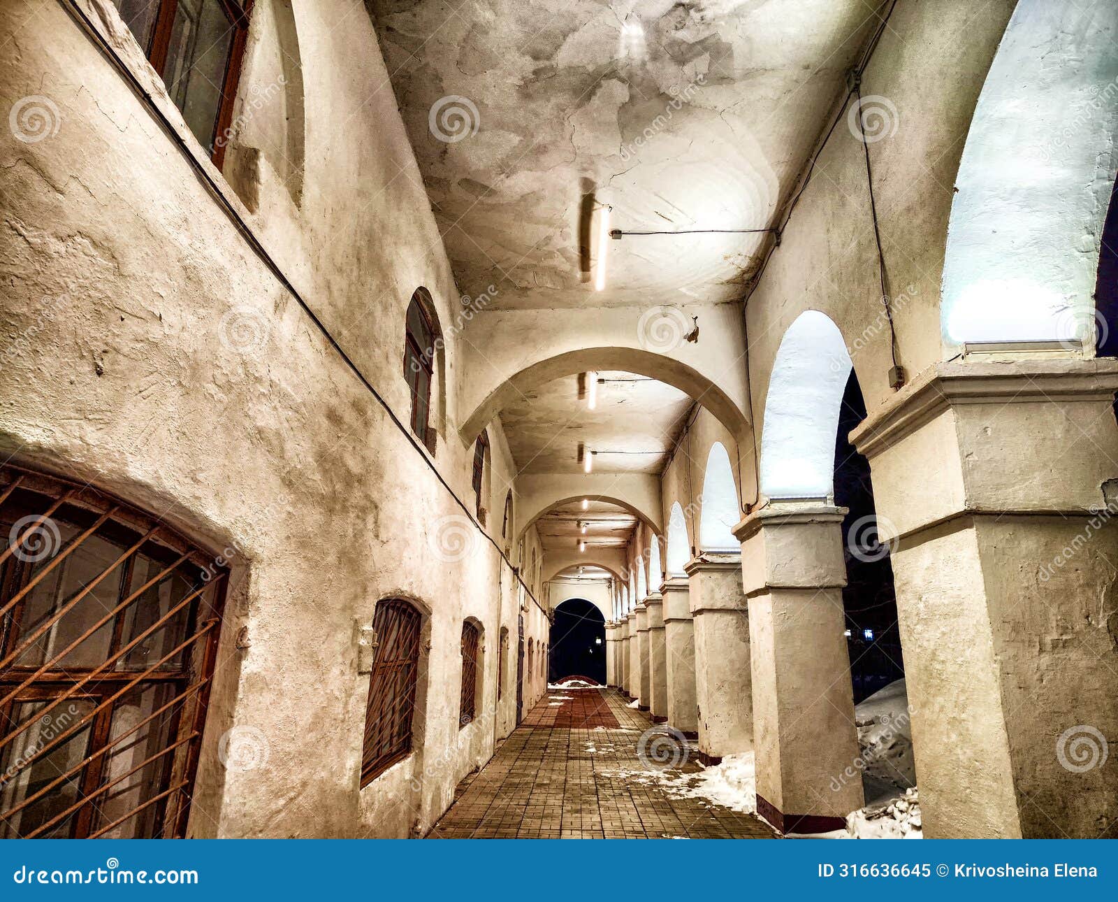 Old Ancient Colonnade Pathway at Night. Dimly Lit Corridor with Arches ...