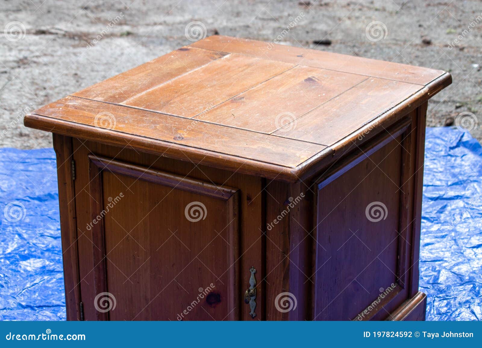 Old Antique Table Set Out on a Blue Tarp Stock Photo - Image of ...