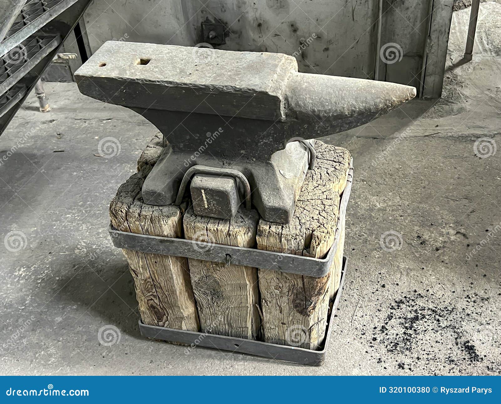 An Old Anvil Standing on a Base Made of Wood Blocks Stock Photo - Image ...