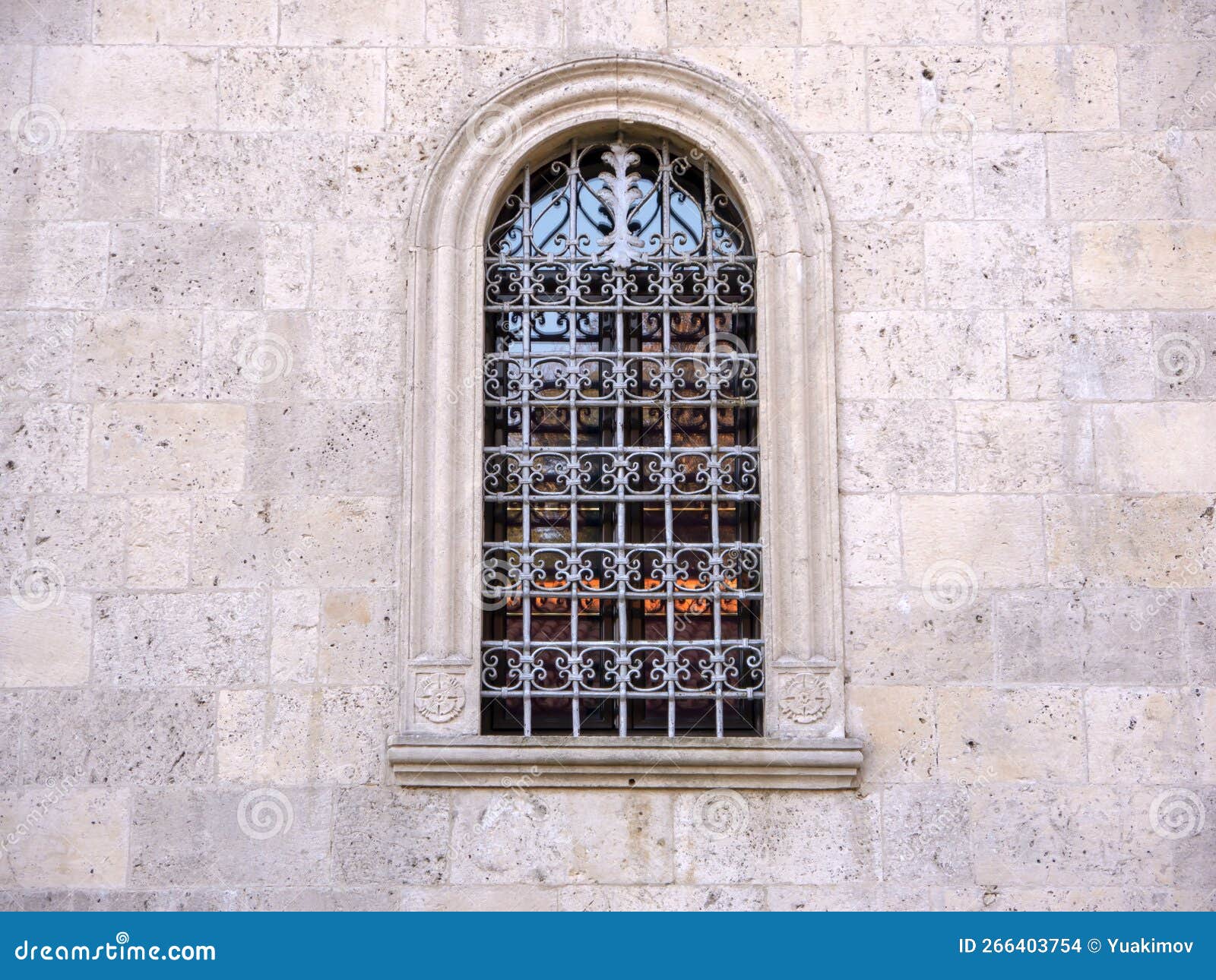 Old Arced Window with Cast Iron Grill and White Stone Blocks Frame ...