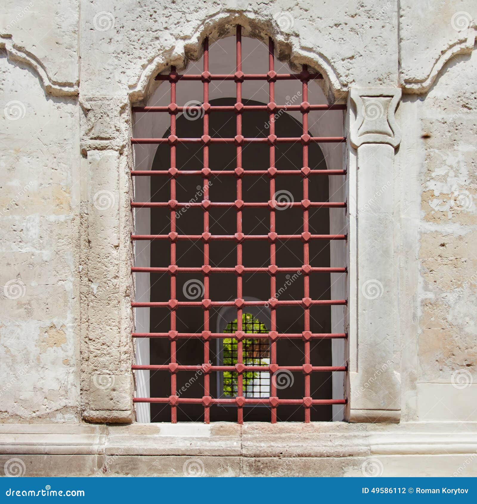 Old Arch Window with Metal Grid in a Stone Wall Stock Photo - Image of ...