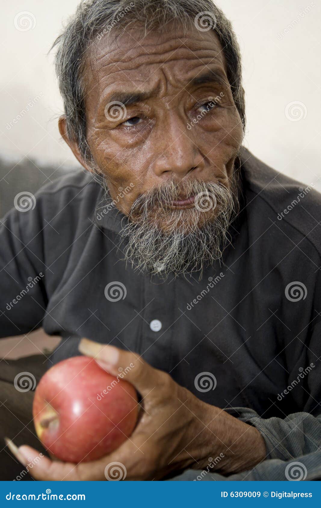 Old asian man with apple stock image. Image of vitamins - 6309009