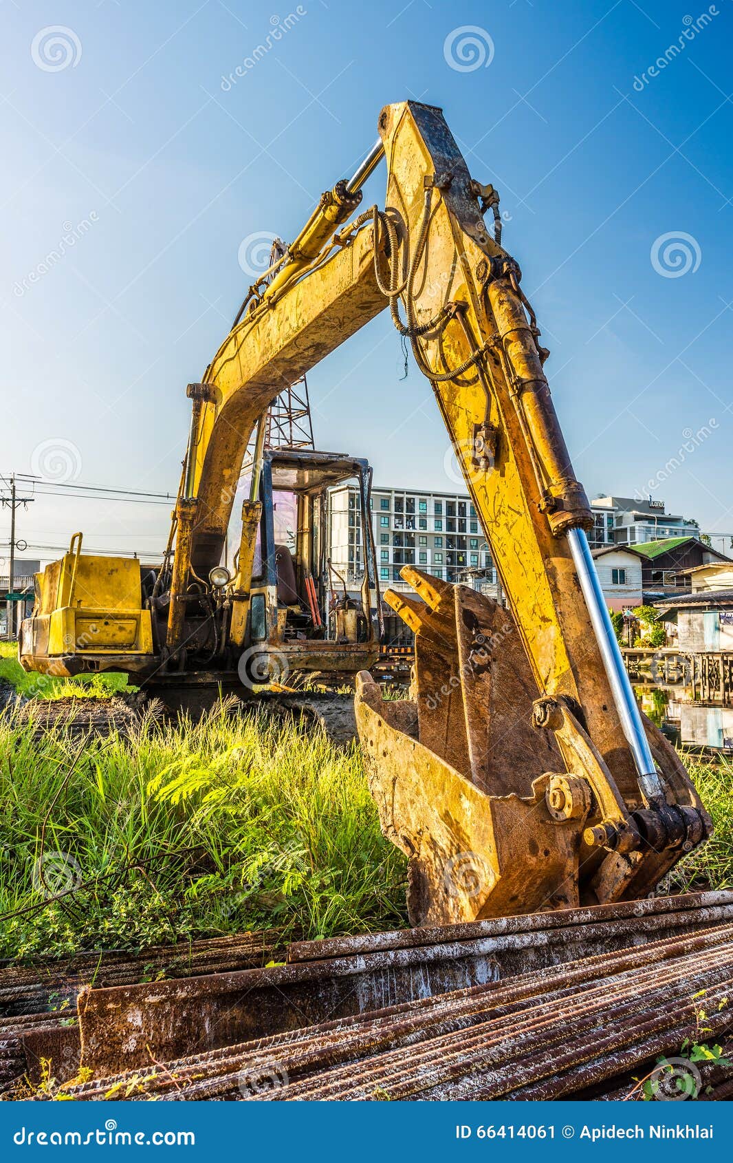 Old Backhoe and Steel Rods at Construction Site Stock Image - Image of ...