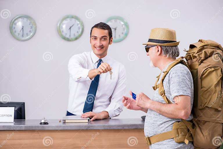Backpacker at the Hotel Reception Stock Image - Image of luggage ...