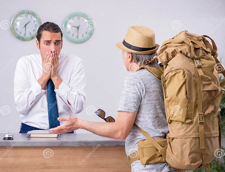 Backpacker at the Hotel Reception Stock Image - Image of business ...