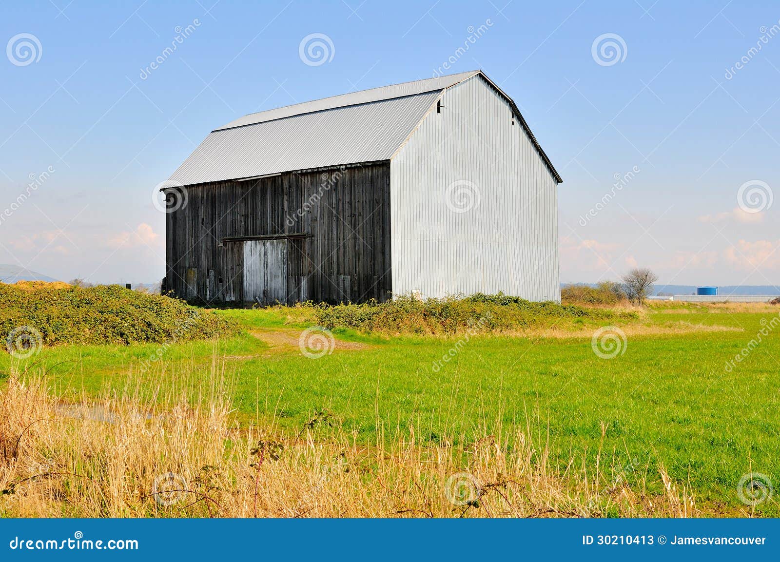 An Old Barn in a Farm Field Stock Image - Image of field, springtime ...