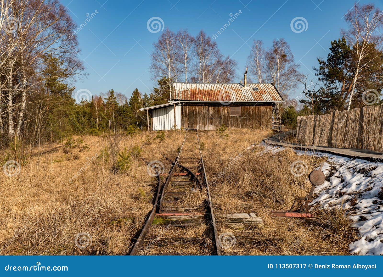 A Old Barn with a Historical Rail in Front Stock Image - Image of ...
