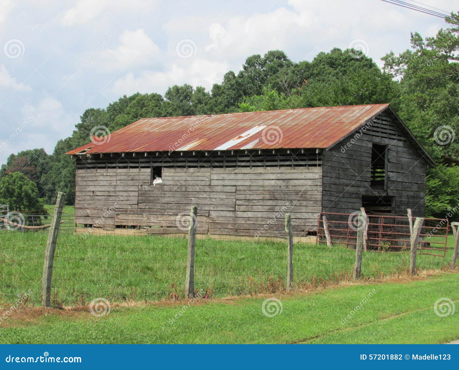 Weathered Old Barn with Rusted Metal Roof Stock Photo - Image of ...