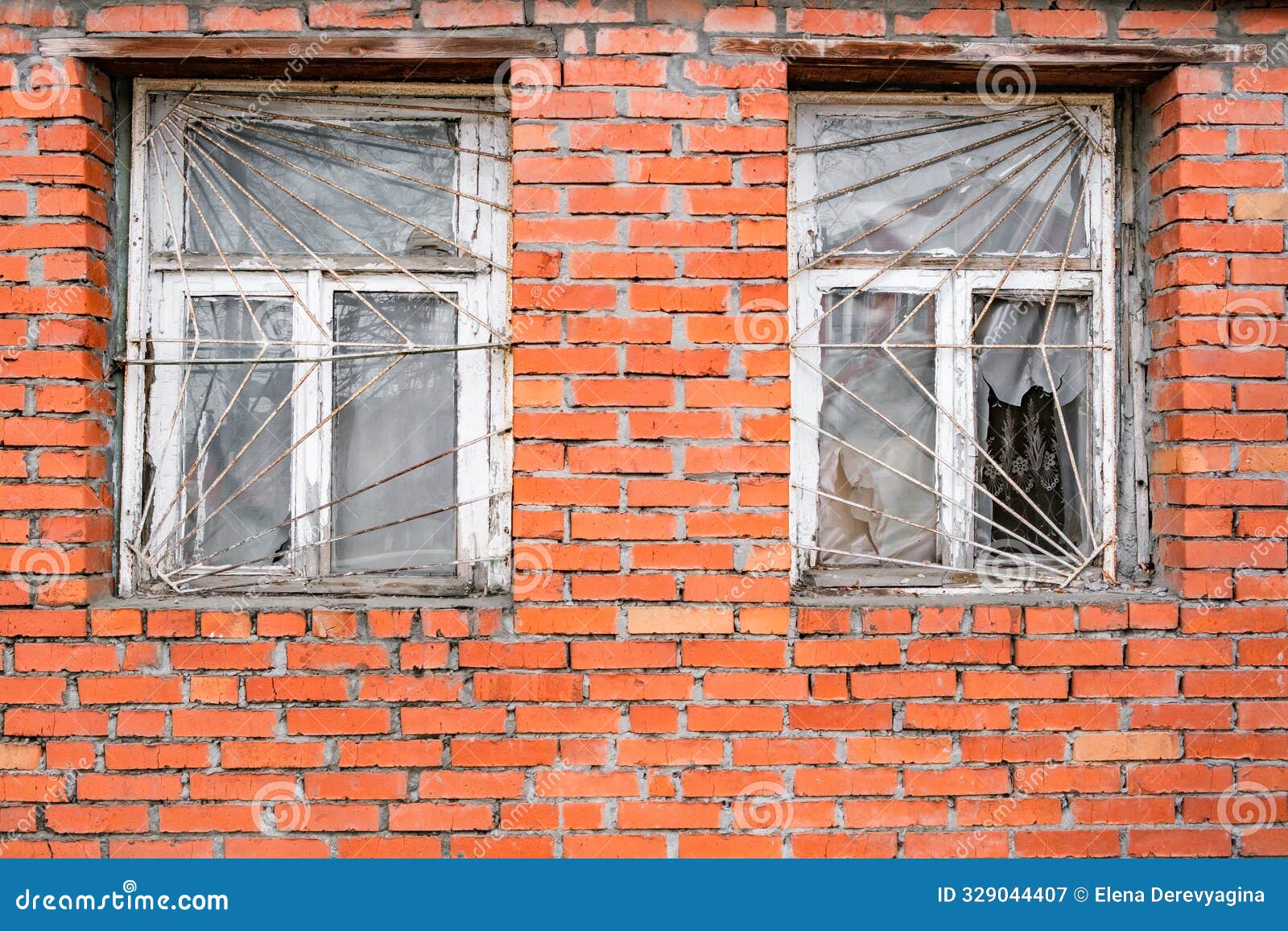 Old Barred Windows on the Brick Wall of the House Stock Image - Image ...