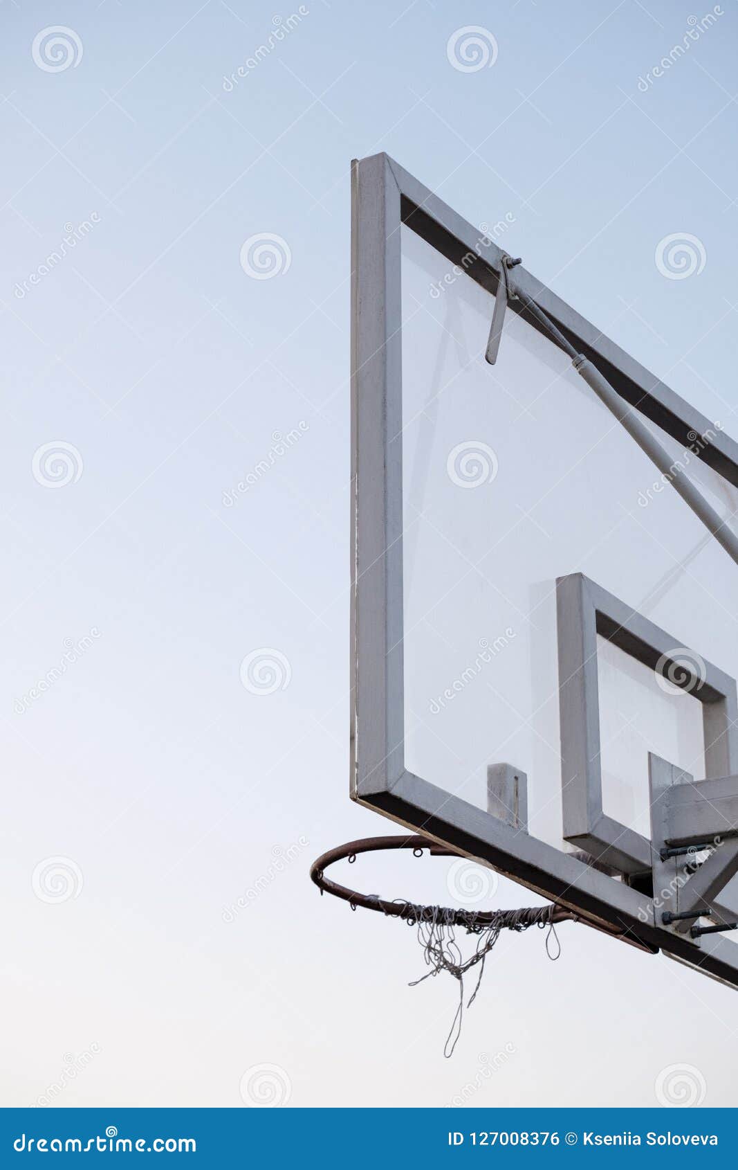 Old Basketball Ring with Torn Netting on the Sky Background Stock Photo ...