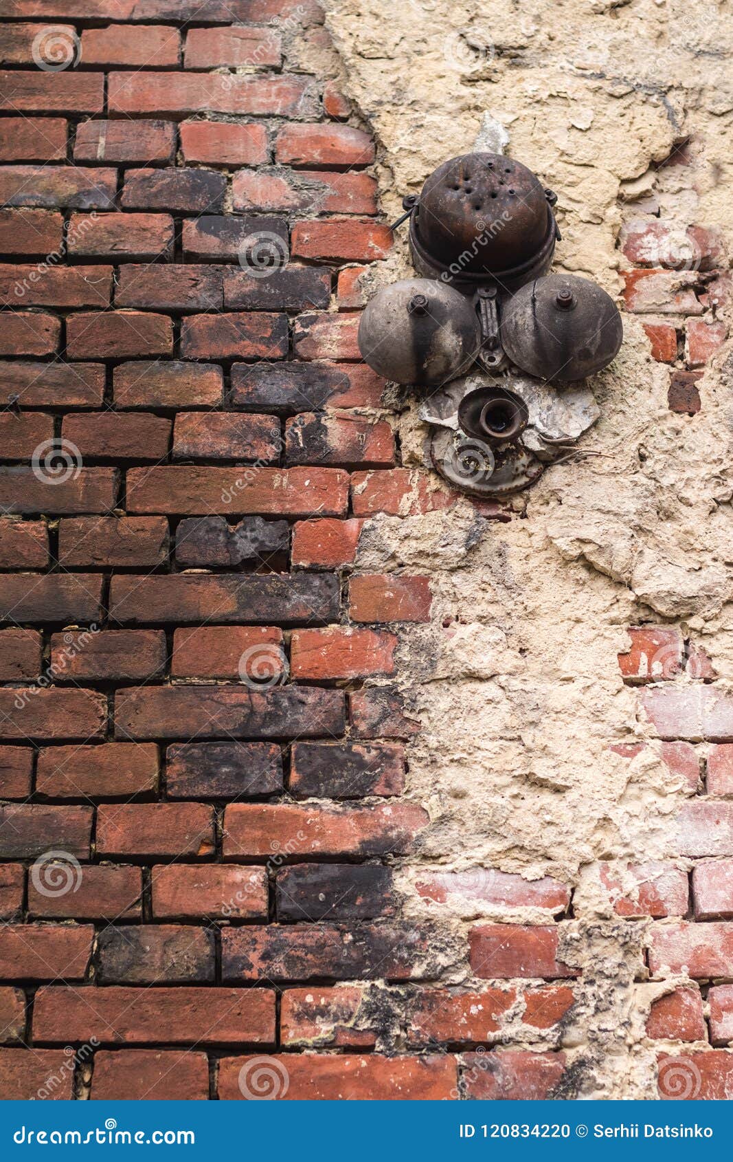 An Old Battered Brick Red Wall with White Plaster and a Rusty Broken ...