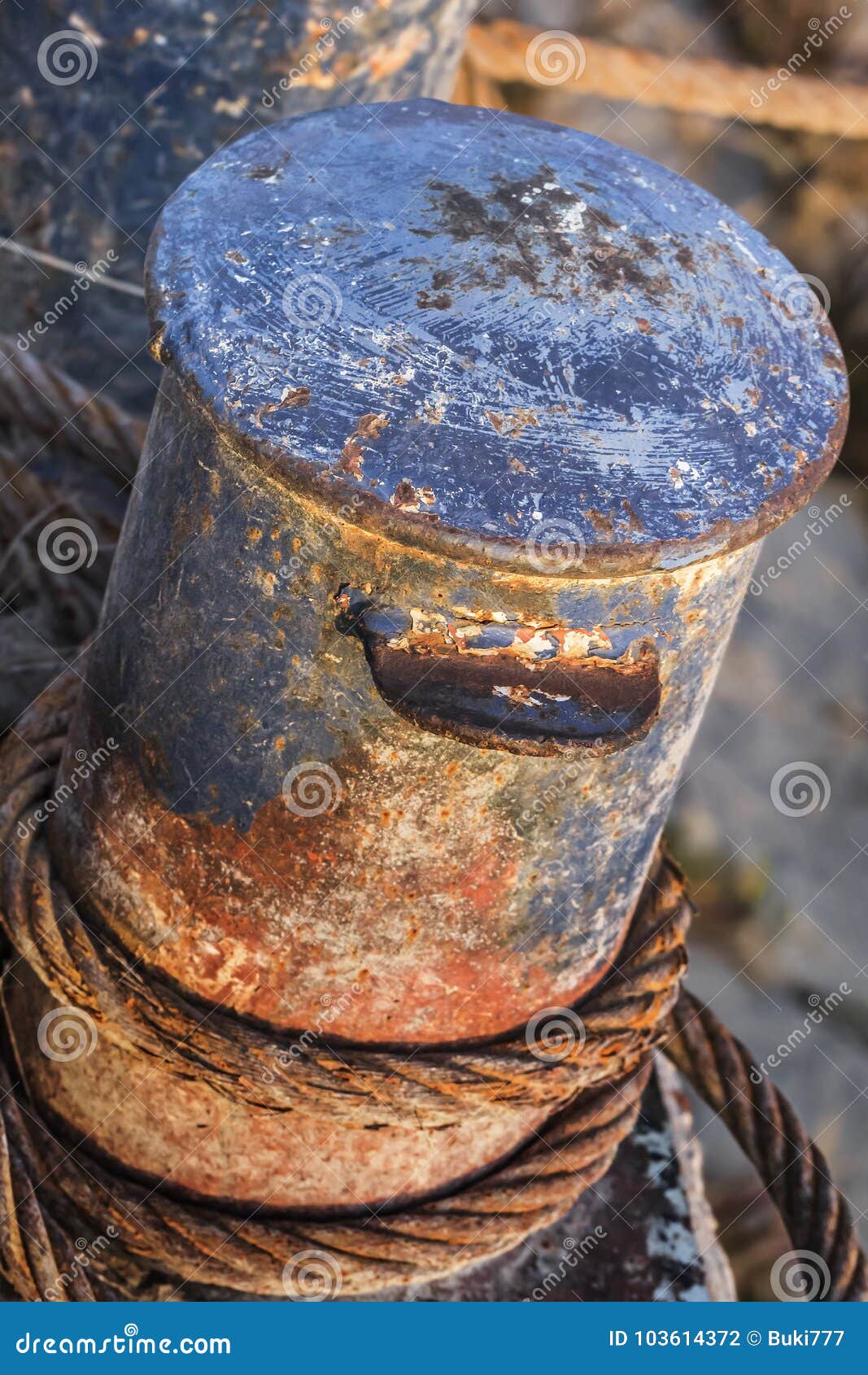 Old Battered Rusty Iron Bollard with Coiled Corroded Steel Cable Stock ...