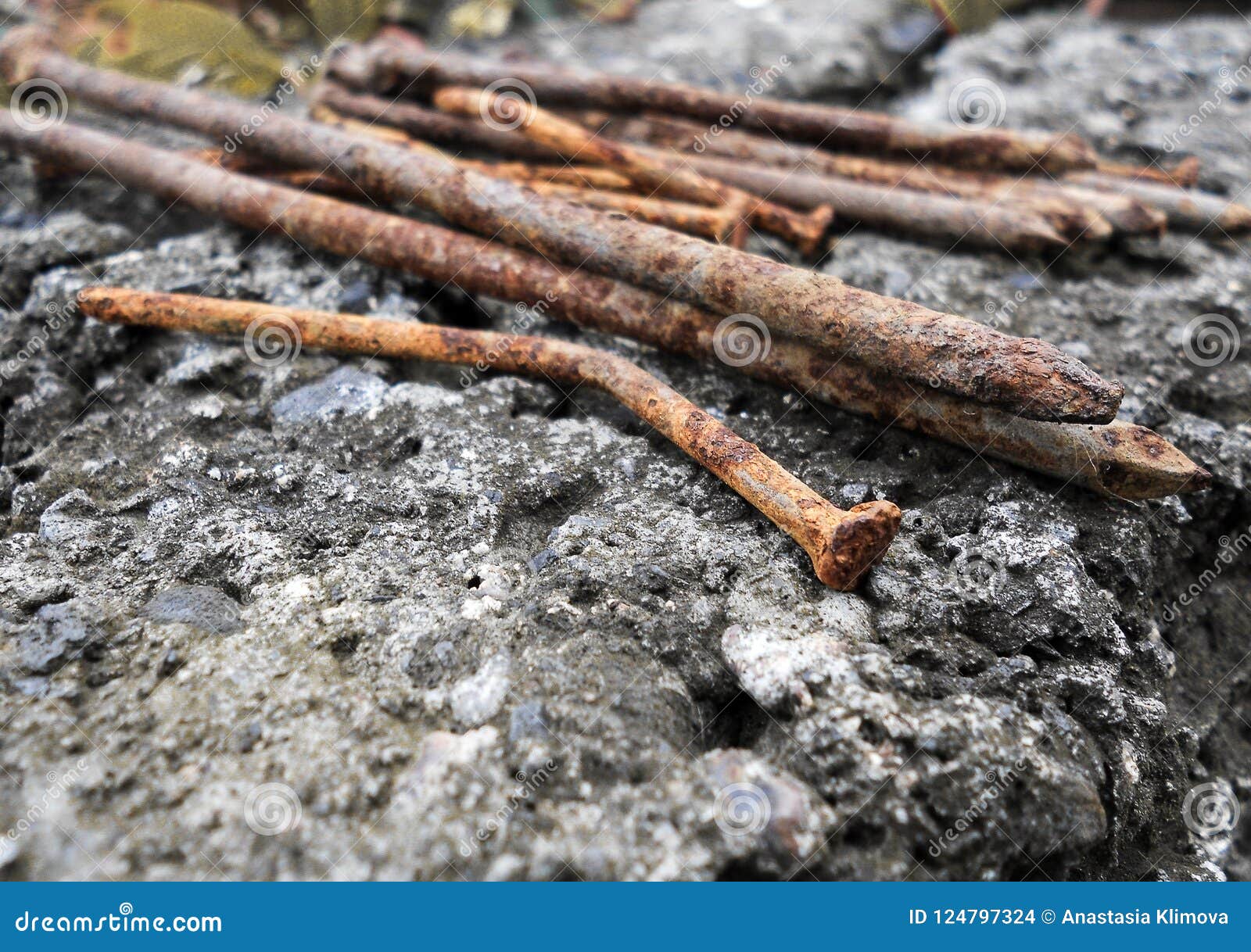 Rusty nails on the stone stock photo. Image of nails - 124797324
