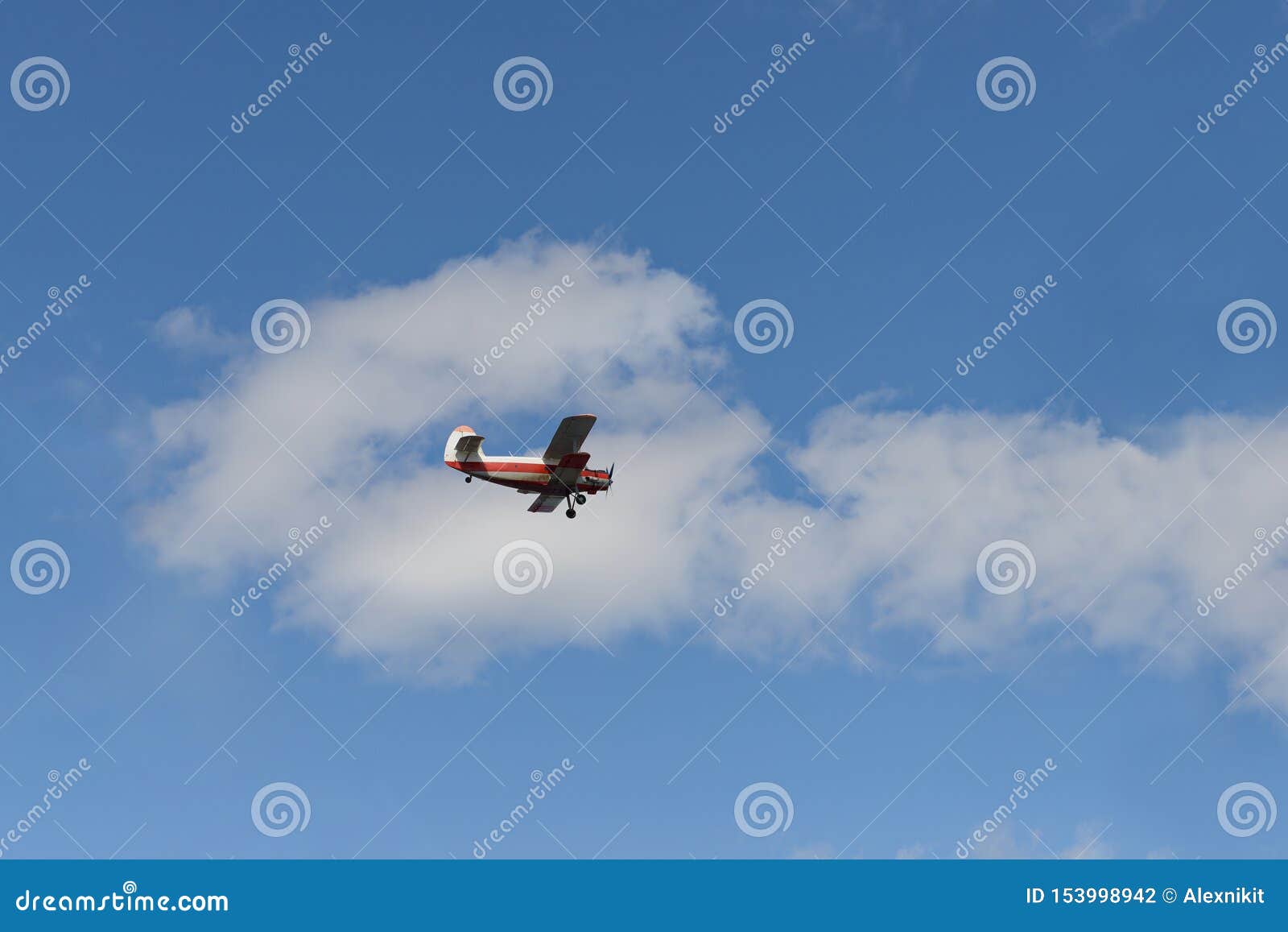 Old Biplane Flying in the Blue Sky Stock Photo - Image of fair, outdoor ...