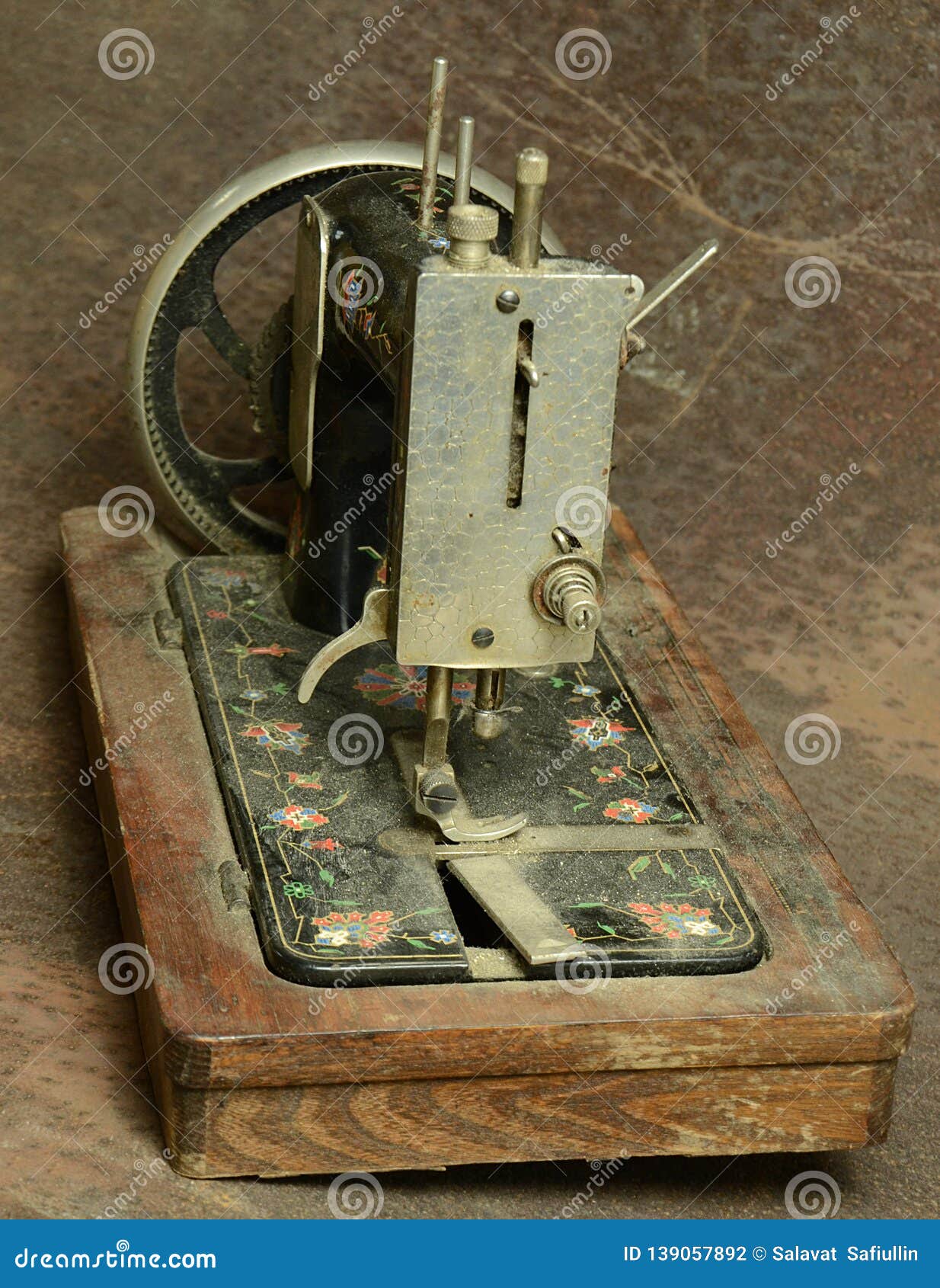 Old Black Sewing Machine on a Sheet of Rusty Iron. Stock Photo - Image ...