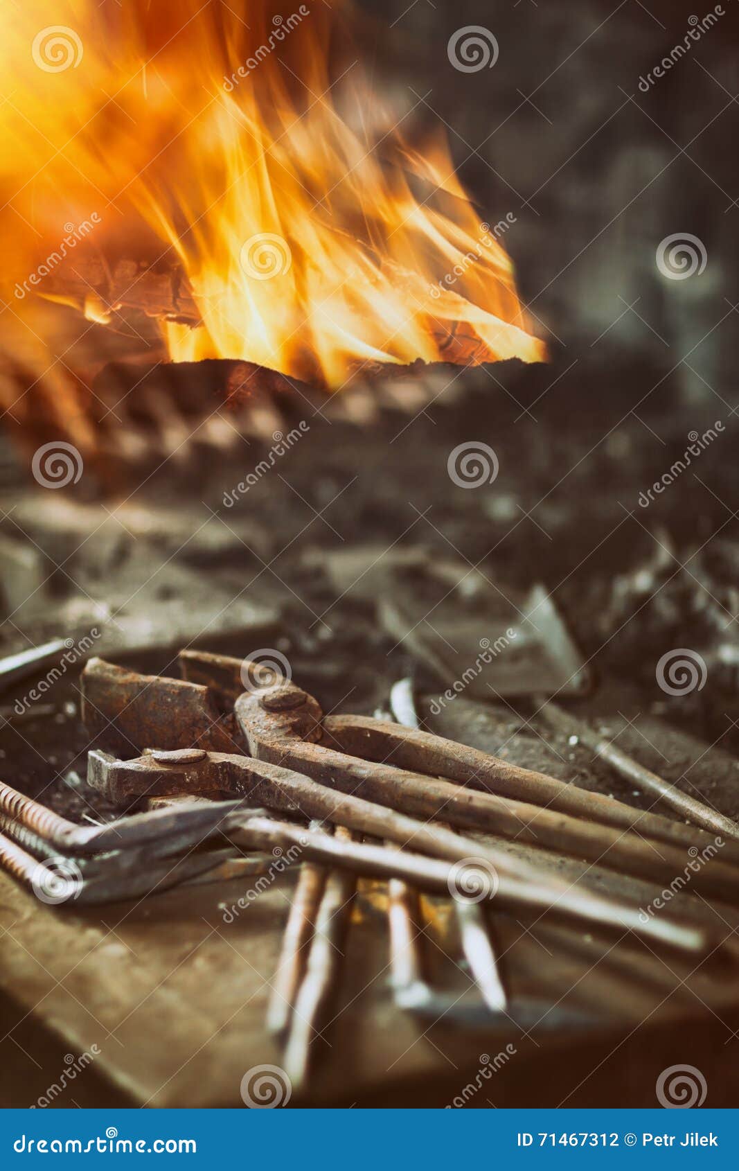 Old Blacksmith Tools On The Medieval Fair. Anvil, Hammer, Fire, Chain ...