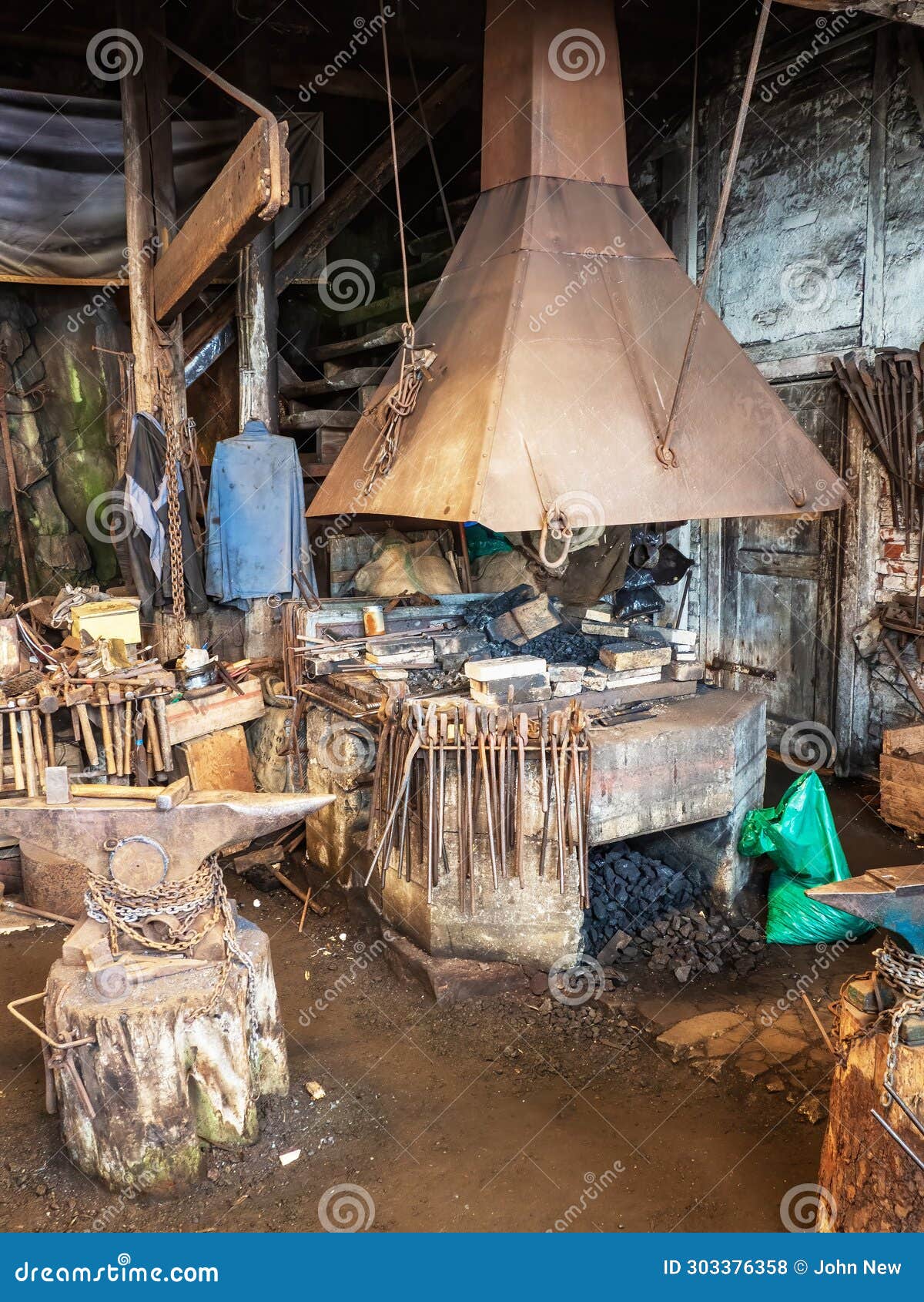 An Old Blacksmiths Forge and Workshop Full of Tools, Portrait View ...