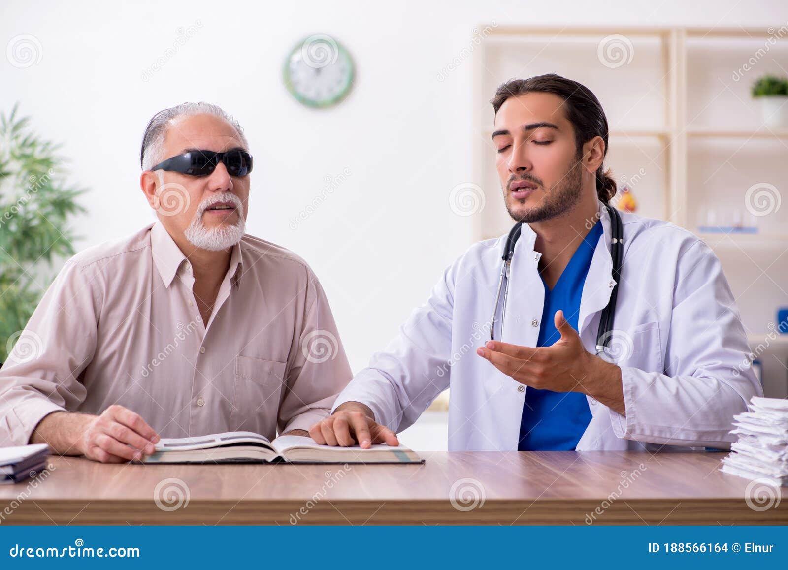 Old Blind Man Visiting Young Male Doctor Stock Photo - Image of book ...