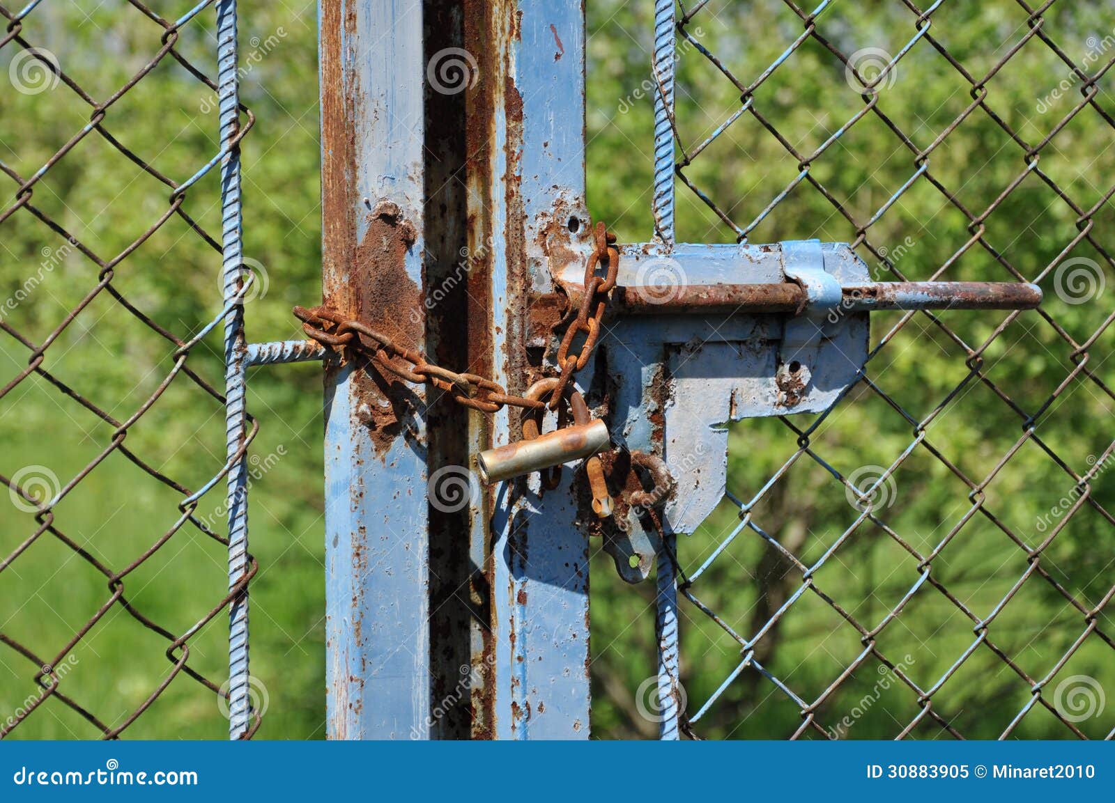 Old blue barrier with lock stock image. Image of gate - 30883905