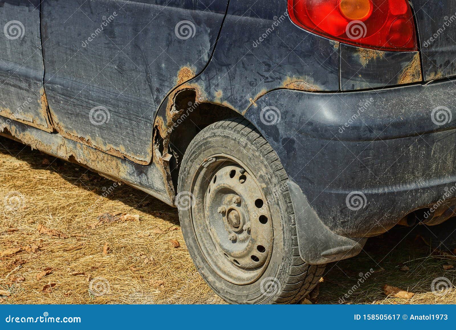 Old Blue Car with a Rusty Wing and a Gray Wheel Stock Image - Image of ...