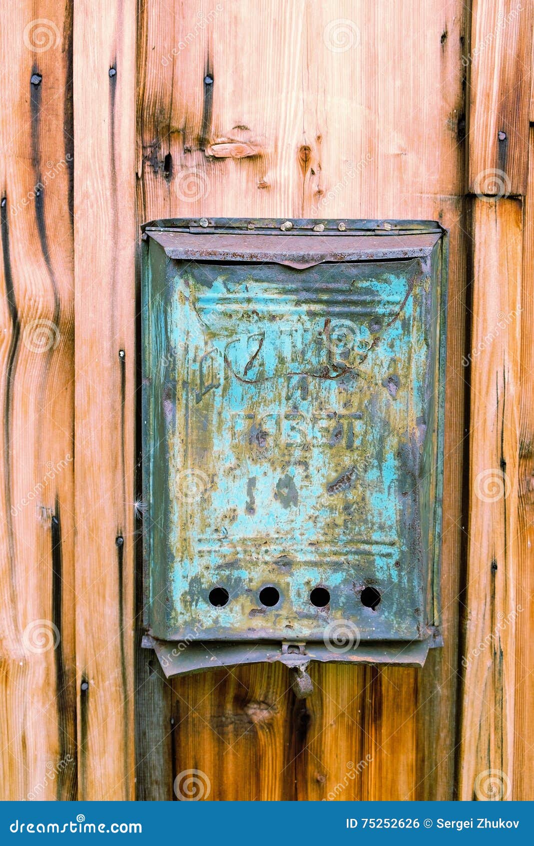 Old Blue Mailbox with Rust and a Hole and Dirty Mail on a Wooden Wall ...