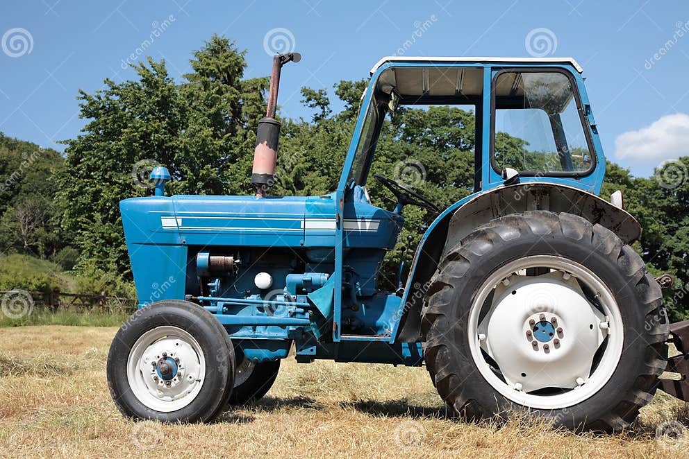 Old Blue Tractor stock image. Image of grass, rural, machinery - 6589211