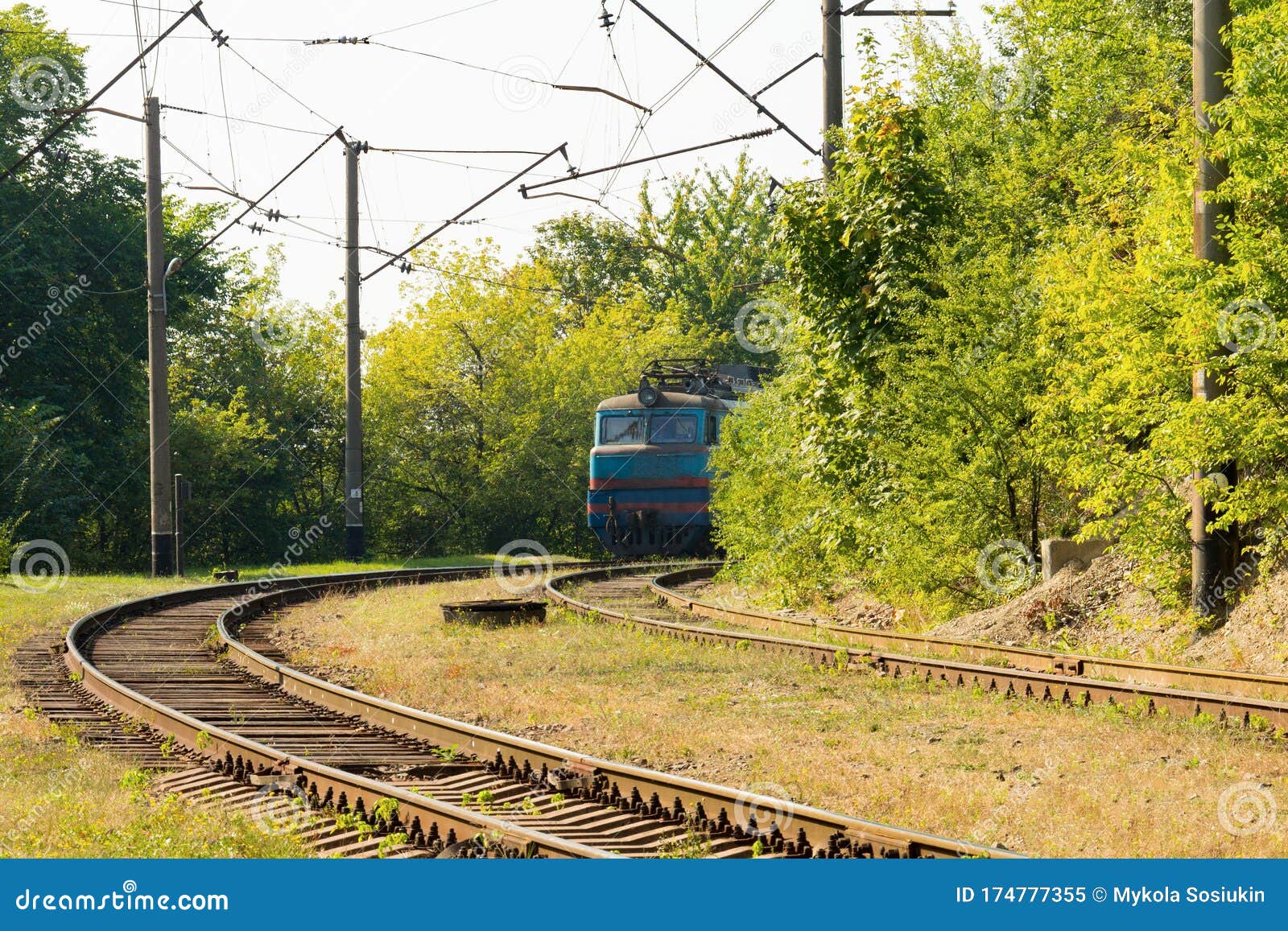 Old Blue Train is Arriving at the Platform at the Railway Station Stock ...