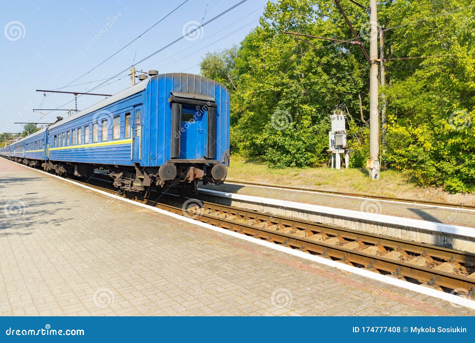 Old Blue Train is Leaving the Platfrom at the Railway Station Stock ...