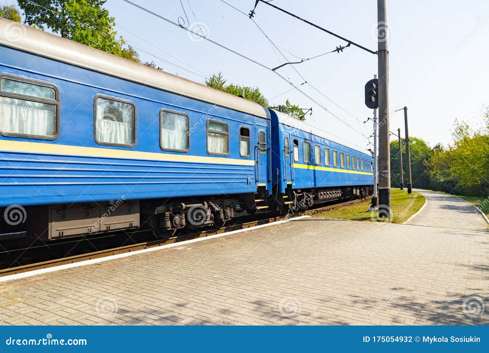 Old Blue Train is Leaving the Platfrom at the Railway Station Stock ...