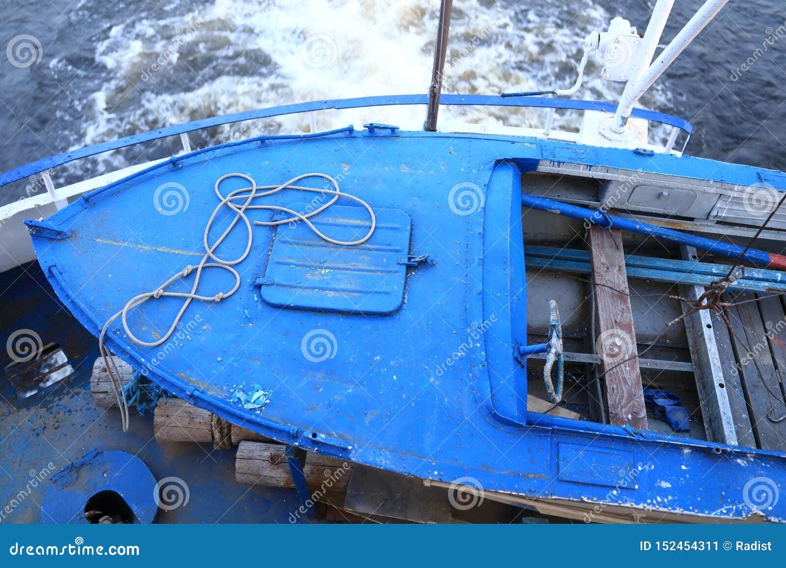 Old boat on deck of ship stock image. Image of rope - 152454311