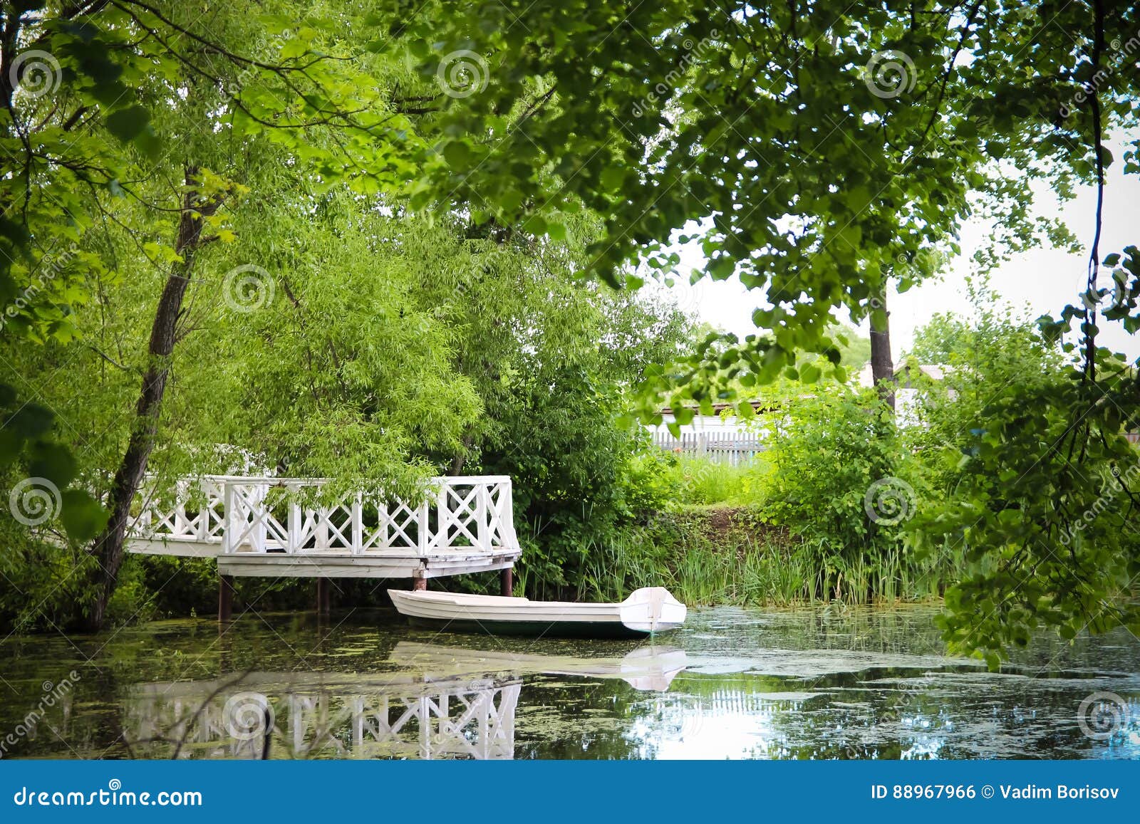 Old Boat in the Trees at the Pier Stock Photo - Image of blue, autumn ...