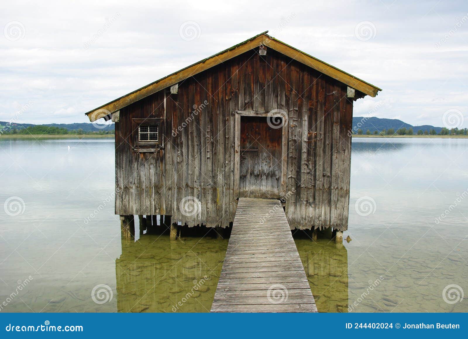 Old boathouse in a sea stock photo. Image of reflection - 244402024