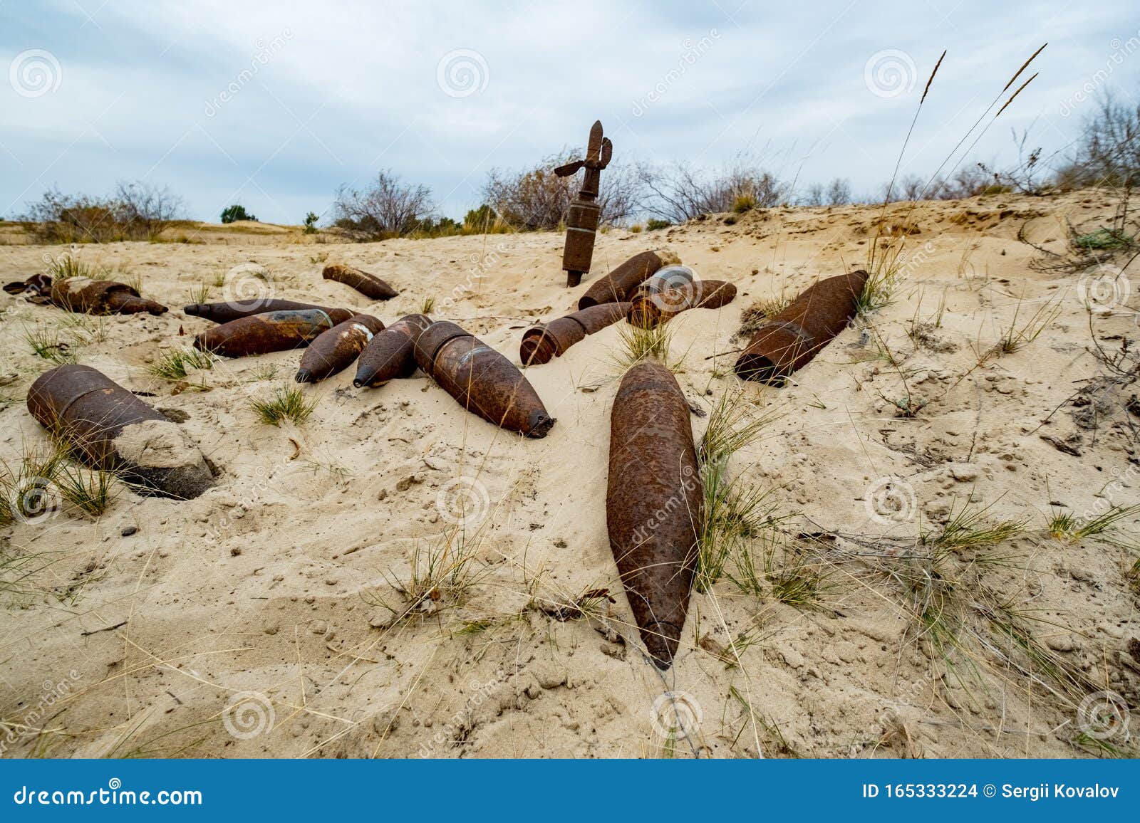 Old bombs in desert stock photo. Image of pile, rust - 165333224