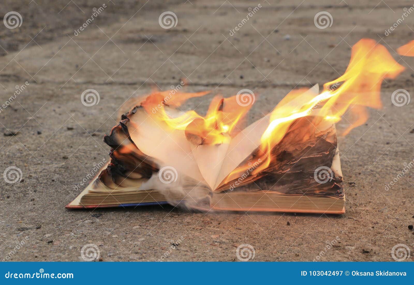 Book with Burning Pages on a Concrete Surface Stock Image - Image of ...