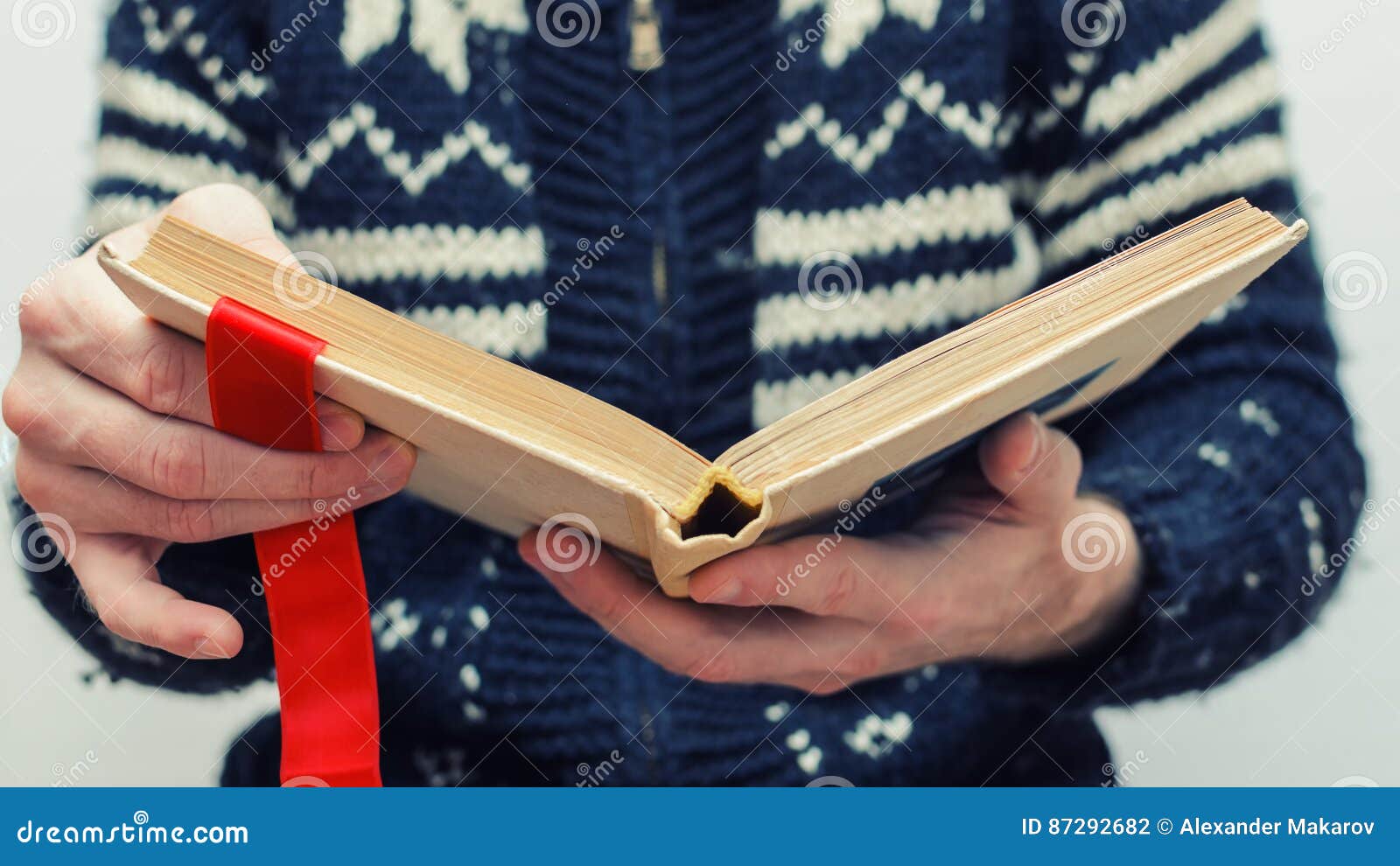 Old Book in His Hands, with a Ribbon between the Pages Stock Photo ...