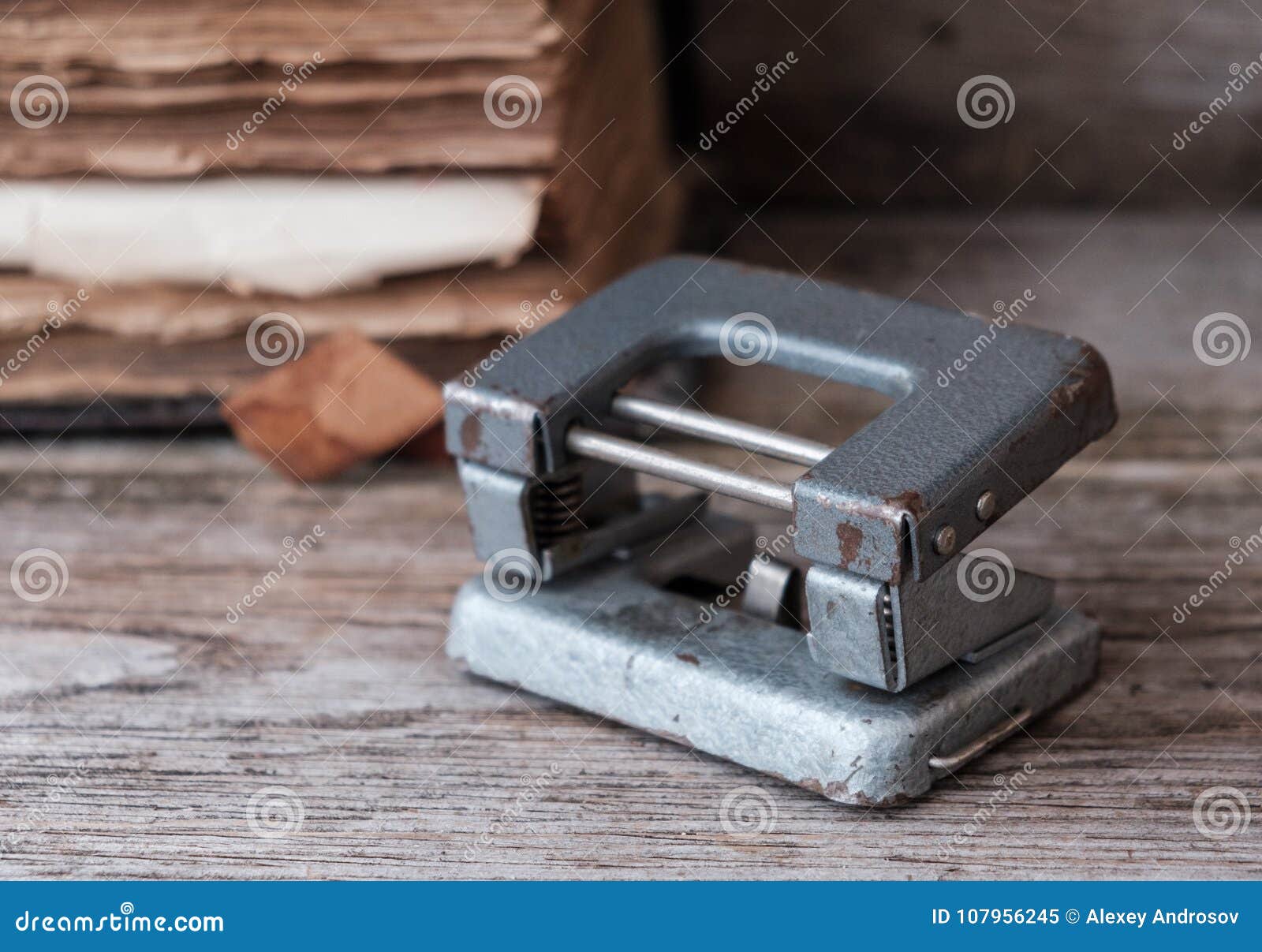 Old Book and Old Hole Punch on the Table Stock Image - Image of button ...