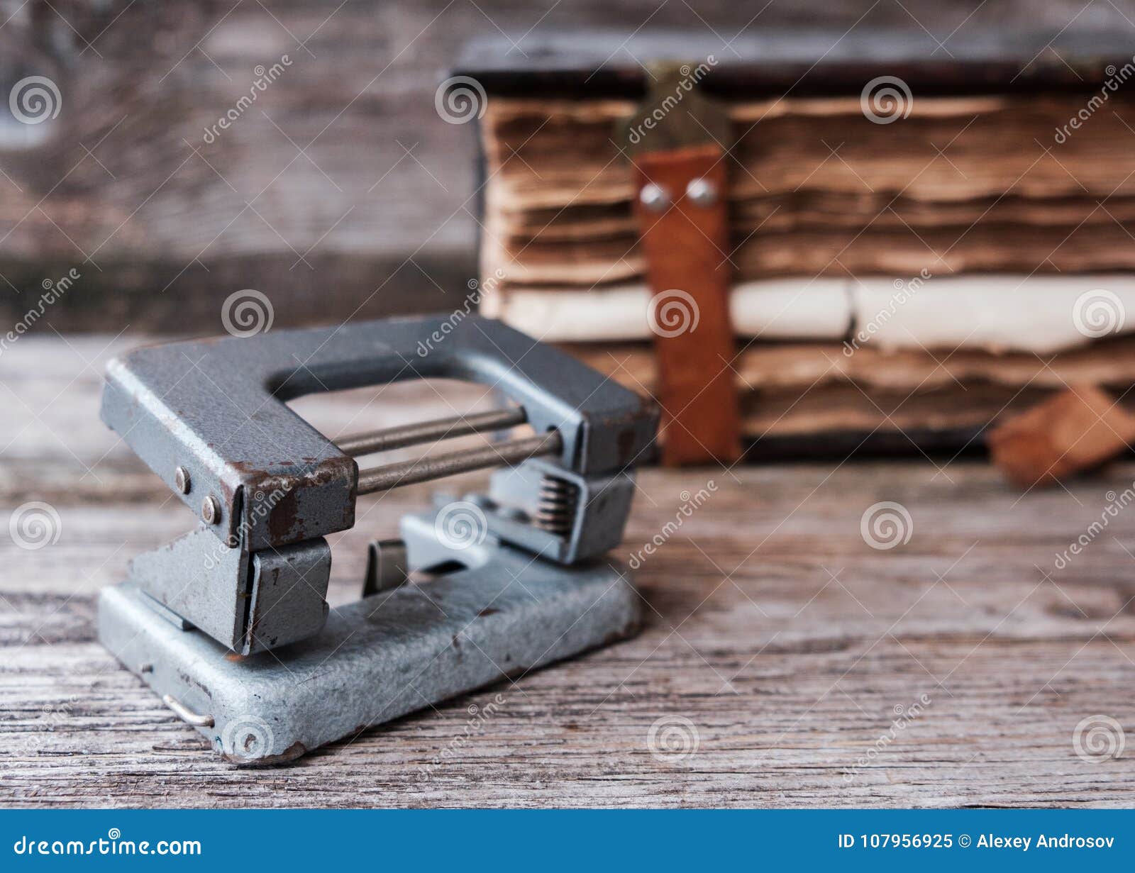 Old Book and Old Hole Punch on the Table Stock Image - Image of ...