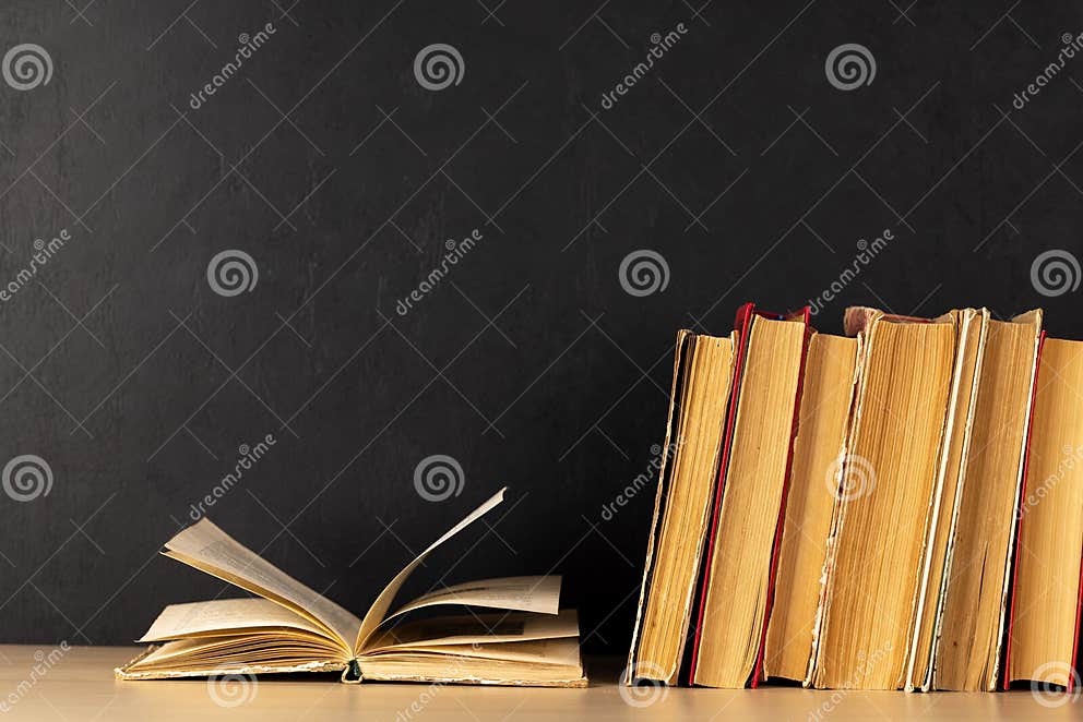 Old Books on a Table, with One Book Open Stock Image - Image of ...