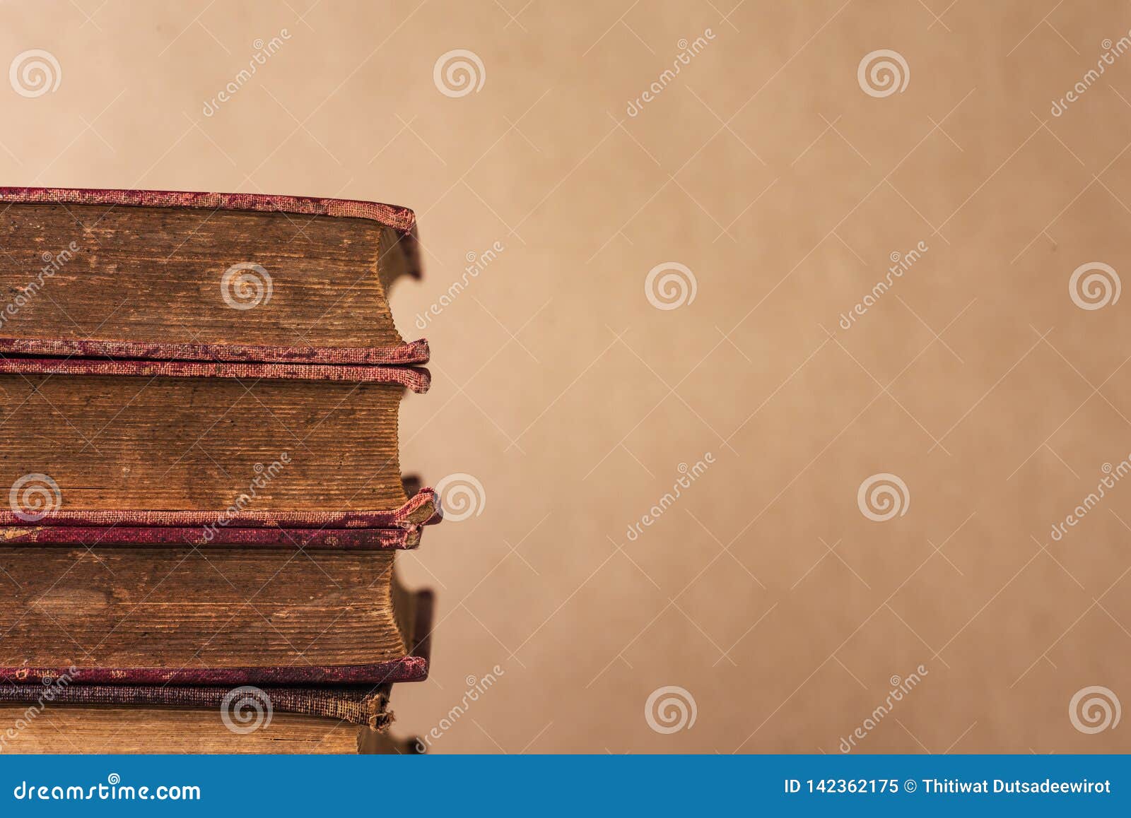 Old books on vintage wall stock image. Image of antique - 142362175
