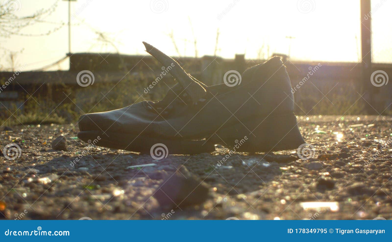 An Old Boot in the Midst of Urban Trash, Lie on the Pavement Under the ...