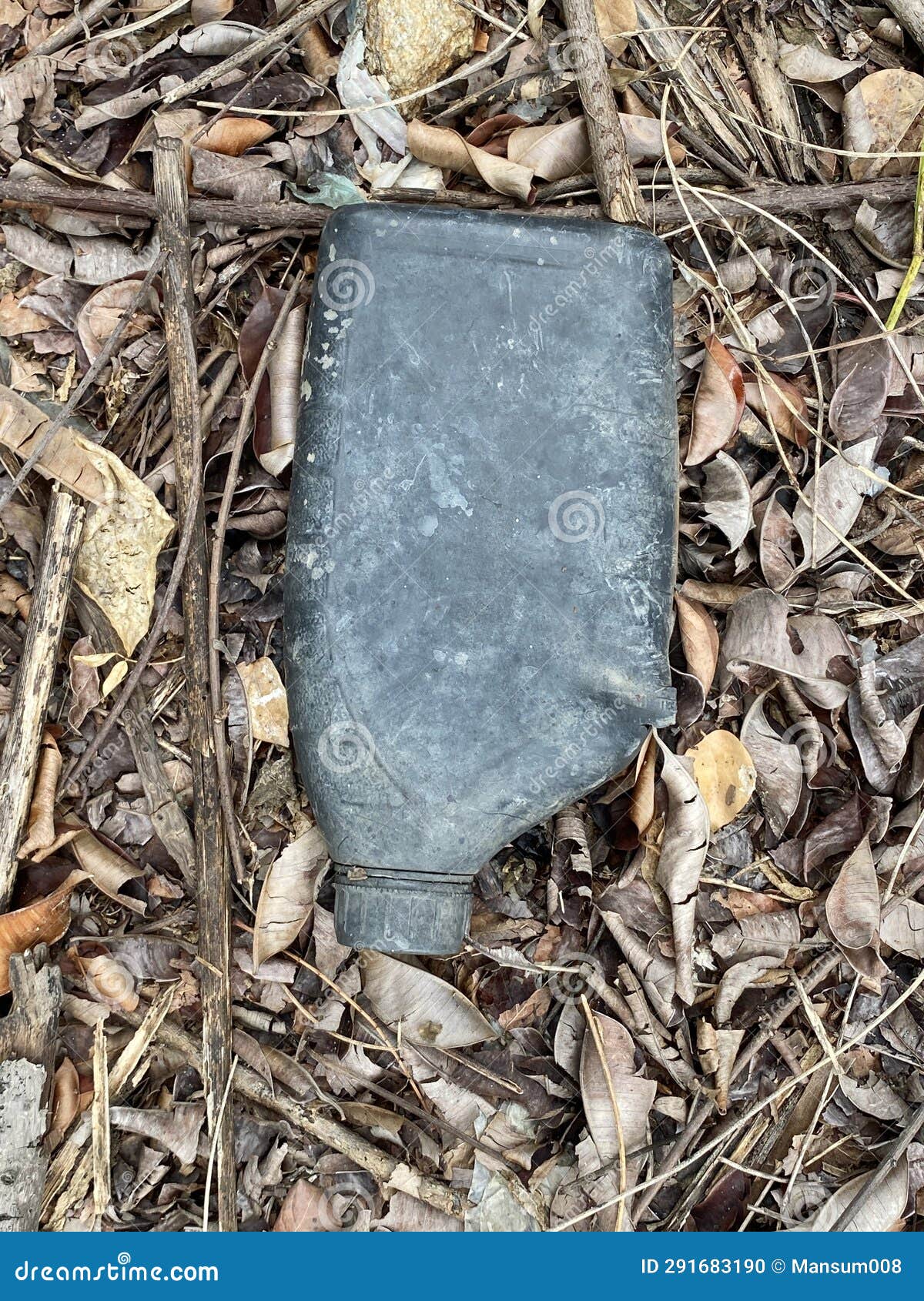 Old bottle on the ground stock photo. Image of close - 291683190