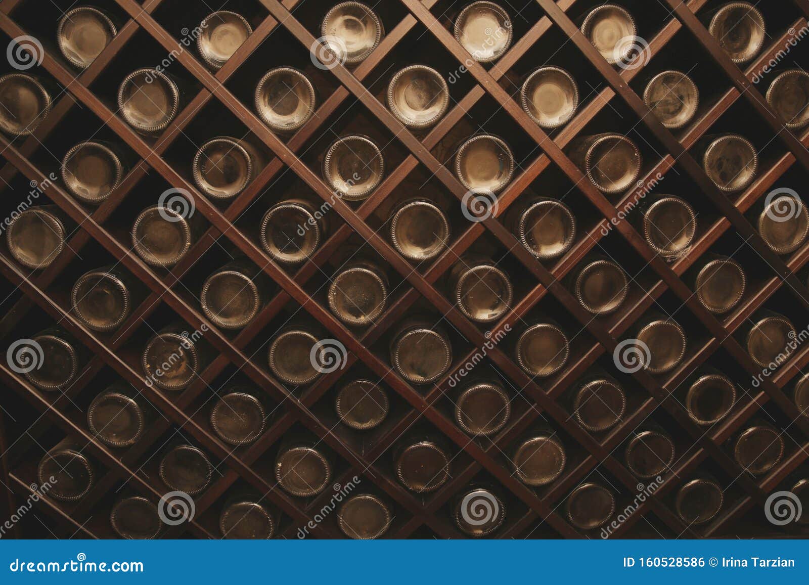 Old Bottles of Wine on the Wall of Dark Wine Cellar. Close-up ...