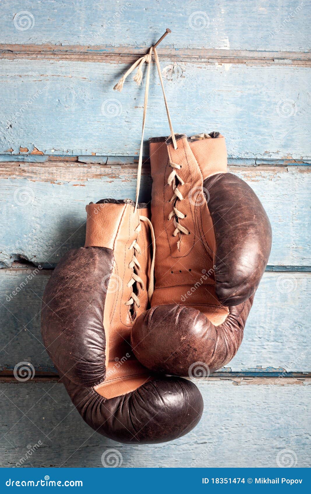 Old Boxing Gloves with a Lace Over Blue Wall Stock Photo - Image of ...